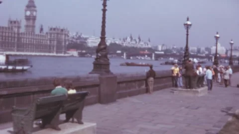 London - 1973: people walk by the Thames... | Stock Video | Pond5