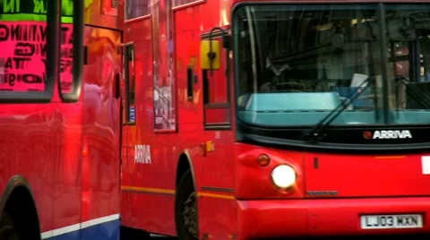 London Bus. Red buses taxis pedestrians ... | Stock Video | Pond5