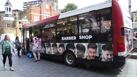 London red bus converted to barbers shop | Stock Video | Pond5