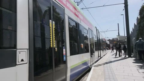 London tram leaving West Croydon station... | Stock Video | Pond5