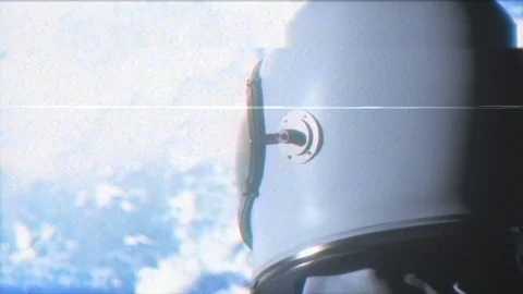 A lone astronaut looks at the planet ear... | Stock Video | Pond5