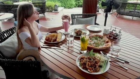 Lonely upset woman sit by table with foo... | Stock Video | Pond5