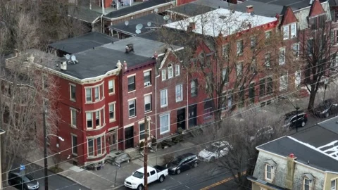 Long aerial zoom in on houses in urban m... | Stock Video | Pond5