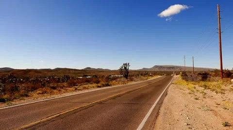 Long and empty road through the desert o... | Stock Video | Pond5