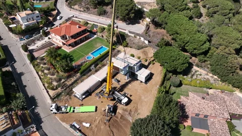 Long crane in construction site of luxur... | Stock Video | Pond5
