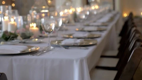 A Long Dinner Table Setup for an Upscale... | Stock Video | Pond5