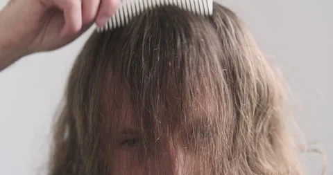 Long flowing hair that covers man's face... | Stock Video | Pond5