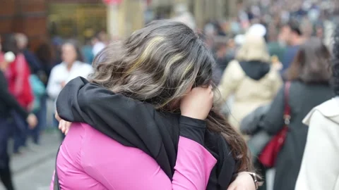 A long goodbye between two girls, embrac... | Stock Video | Pond5