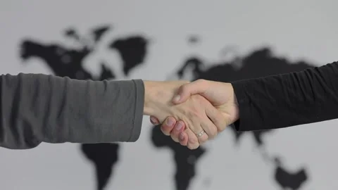 Long handshake of two men near black wor... | Stock Video | Pond5