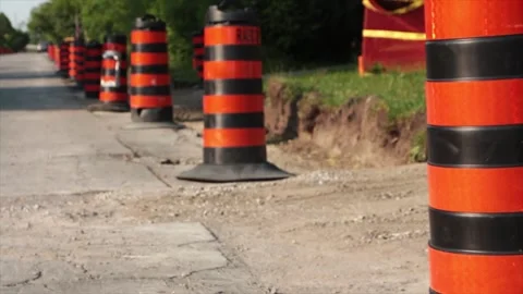 long line row of orange and black traffi... | Stock Video | Pond5