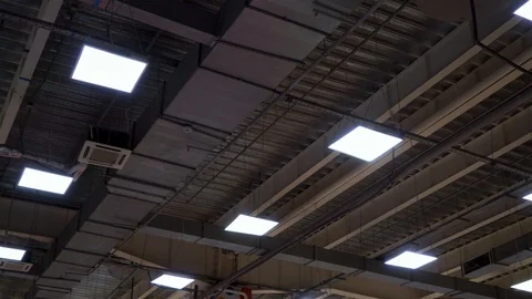 long pipes of hvac system and lamps hang... | Stock Video | Pond5