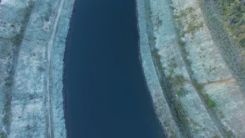 Looking down at river tilting upwards to... | Stock Video | Pond5
