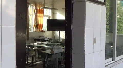 Looking into the messy empty classroom t... | Stock Video | Pond5