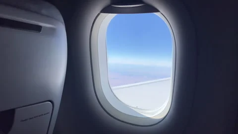 Looking out airplane window with wing in... | Stock Video | Pond5