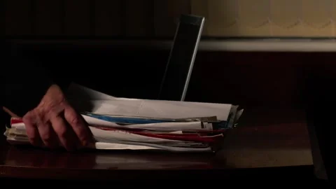 Looking at pile of paper files on desk i... | Stock Video | Pond5