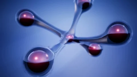 loop atom model on colored background | Stock Video | Pond5