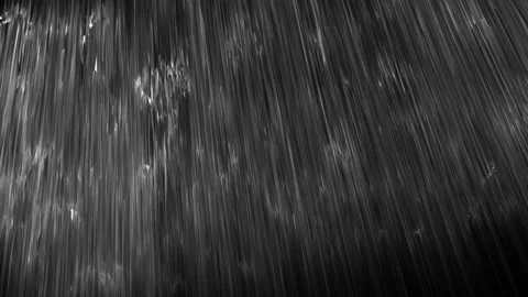 Loop footage of rain falling on black ba... | Stock Video | Pond5