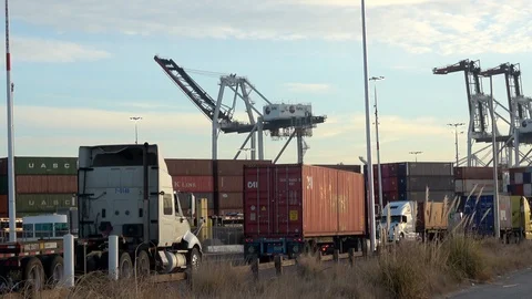 Lorries trucking freight at the port ter... | Stock Video | Pond5