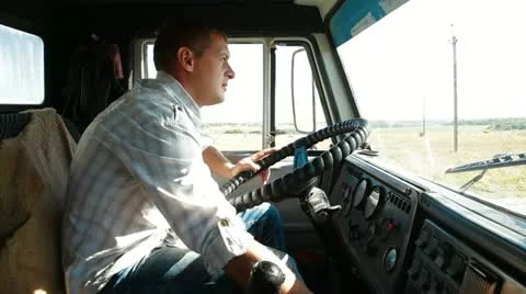 Lorry Driver at the Wheel of Truck | Stock Video | Pond5