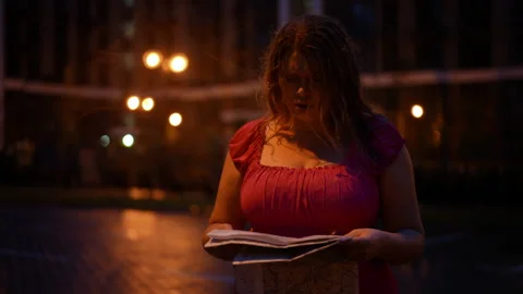 Lost woman with paper map standing on em... | Stock Video | Pond5