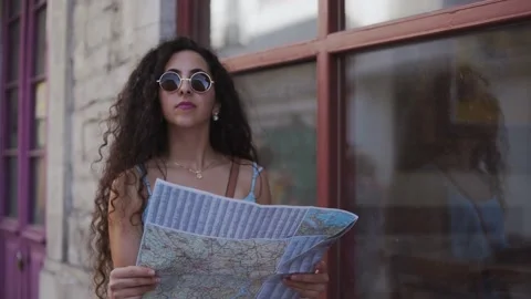 Lost woman tourist reading map in old It... | Stock Video | Pond5