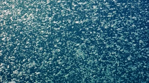 A lot of air bubbles rise from deep of O... | Stock Video | Pond5