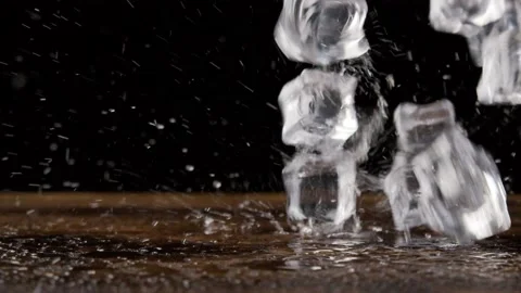 Lot of ice cubes rapidly falling down on... | Stock Video | Pond5