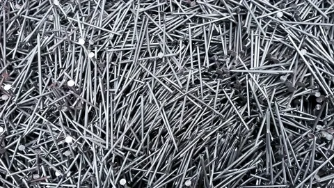 A lot of long metal nails top view close... | Stock Video | Pond5