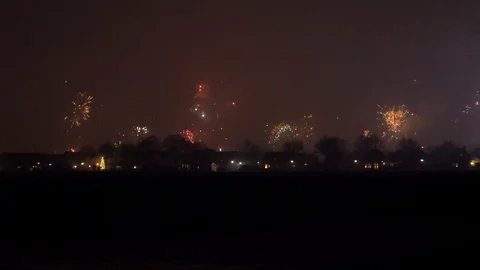 Lots of fireworks in background with a s... | Stock Video | Pond5