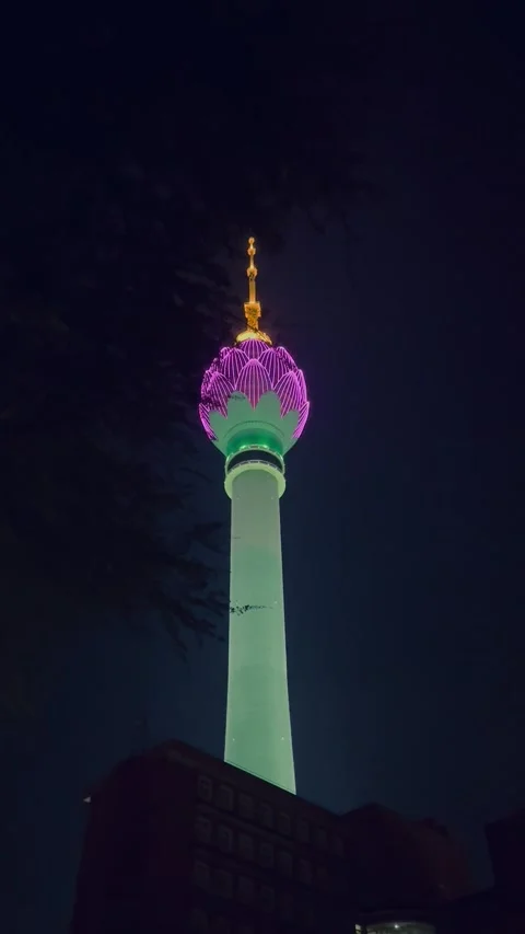 Lotus tower slow static shot at night, C... | Stock Video | Pond5