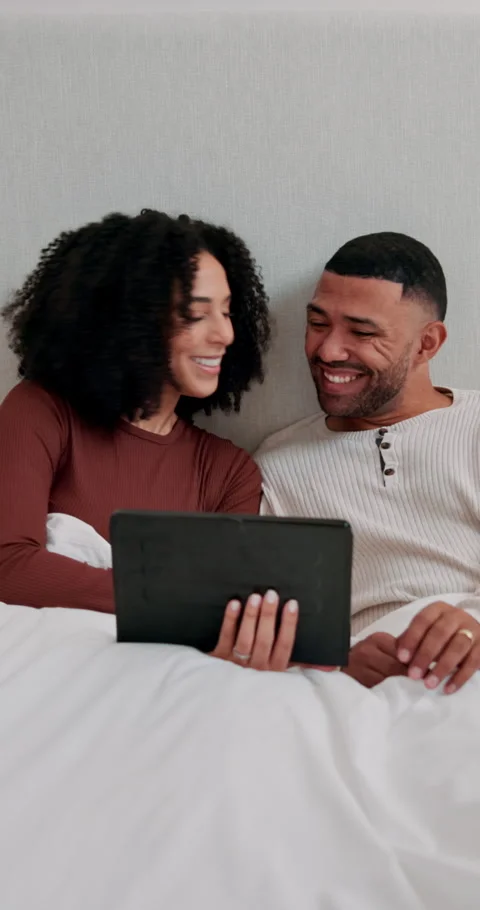 Love, tablet and couple in bed for relax... | Stock Video | Pond5