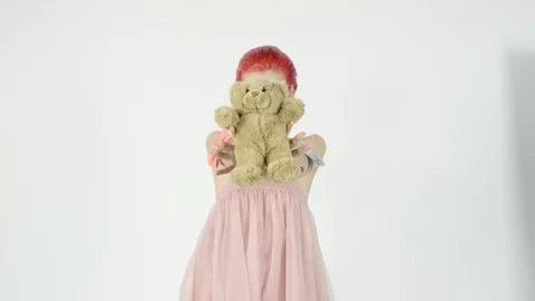 A lovely girl hugs and kisses a cute ted... | Stock Video | Pond5