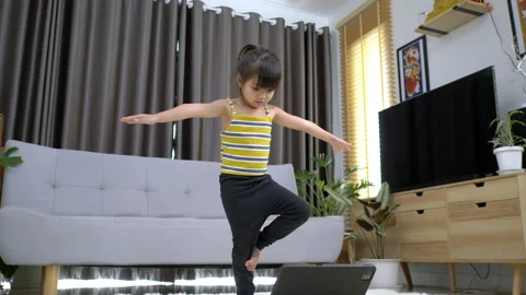 Lovely girl practic from tablet with sta... | Stock Video | Pond5