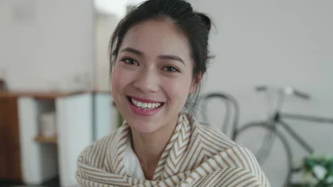 Lovely young asian Girl looking at camer... | Stock Video | Pond5