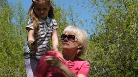 Loving cute granddaughter with her gran... | Stock Video | Pond5