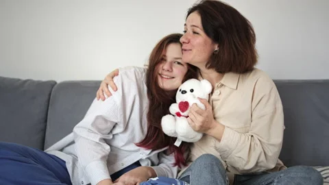 Loving cute teen daughter hugs happy mot... | Stock Video | Pond5