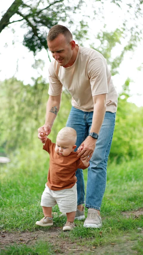 Loving dad leaned over his son holding h... | Stock Video | Pond5