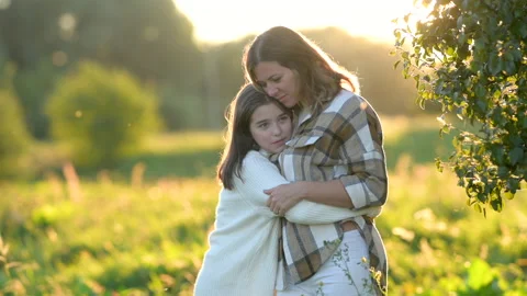 Loving tender mum hugging with a cute da... | Stock Video | Pond5