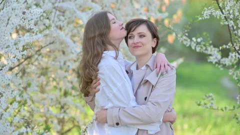 Loving tender mum hugging with a cute da... | Stock Video | Pond5