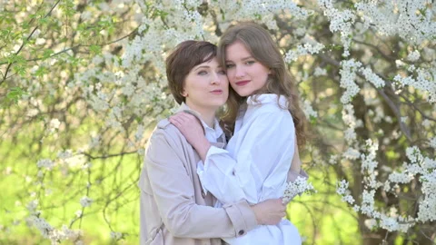 Loving tender mum hugging with a cute da... | Stock Video | Pond5