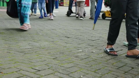 Low angle crowd of people walking showin... | Stock Video | Pond5