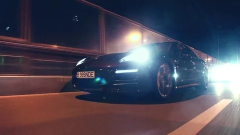 Low angle rolling shot of a Porsche Pana... | Stock Video | Pond5