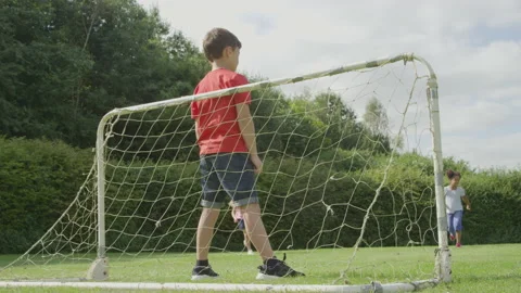 Low Angle Shot Behind Goal Net of Childr... | Stock Video | Pond5