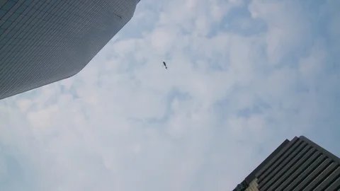 A low angle shot of a chopper flying in ... | Stock Video | Pond5