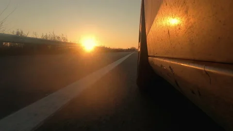 Low angle side view of car driving fast ... | Stock Video | Pond5