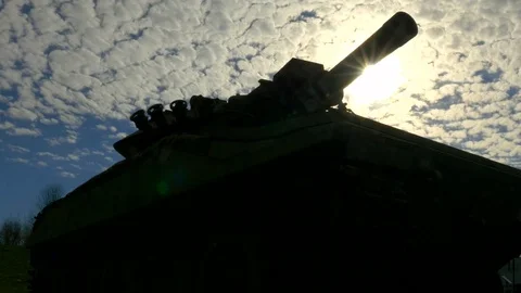 Low angle tank silhouette with sun and c... | Stock Video | Pond5