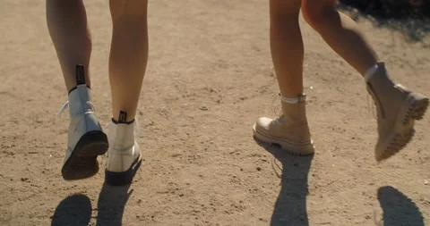 Low angle video: legs of two young woman... | Stock Video | Pond5