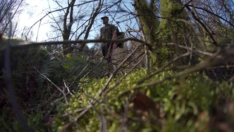 Low ground shot of a man walking through... | Stock Video | Pond5