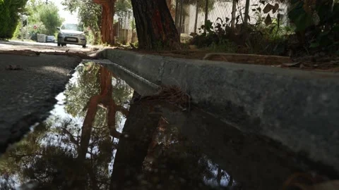 Low ground view of water ditch next to p... | Stock Video | Pond5