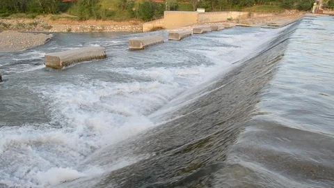 Low head dam - Weir on Secchia River | Stock Video | Pond5